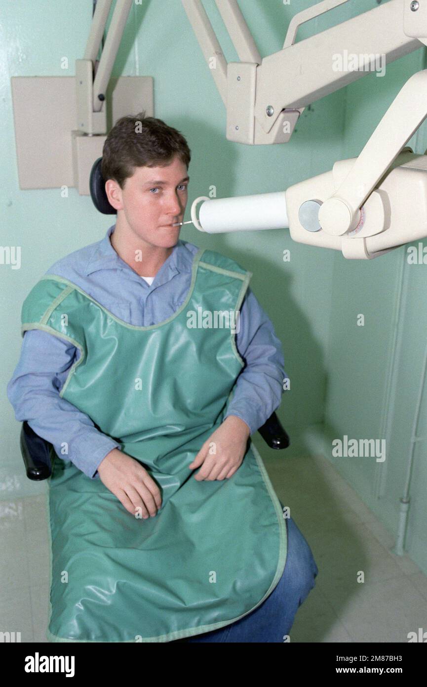 A sailor receives a dental x-ray while aboard the nuclear-powered ...