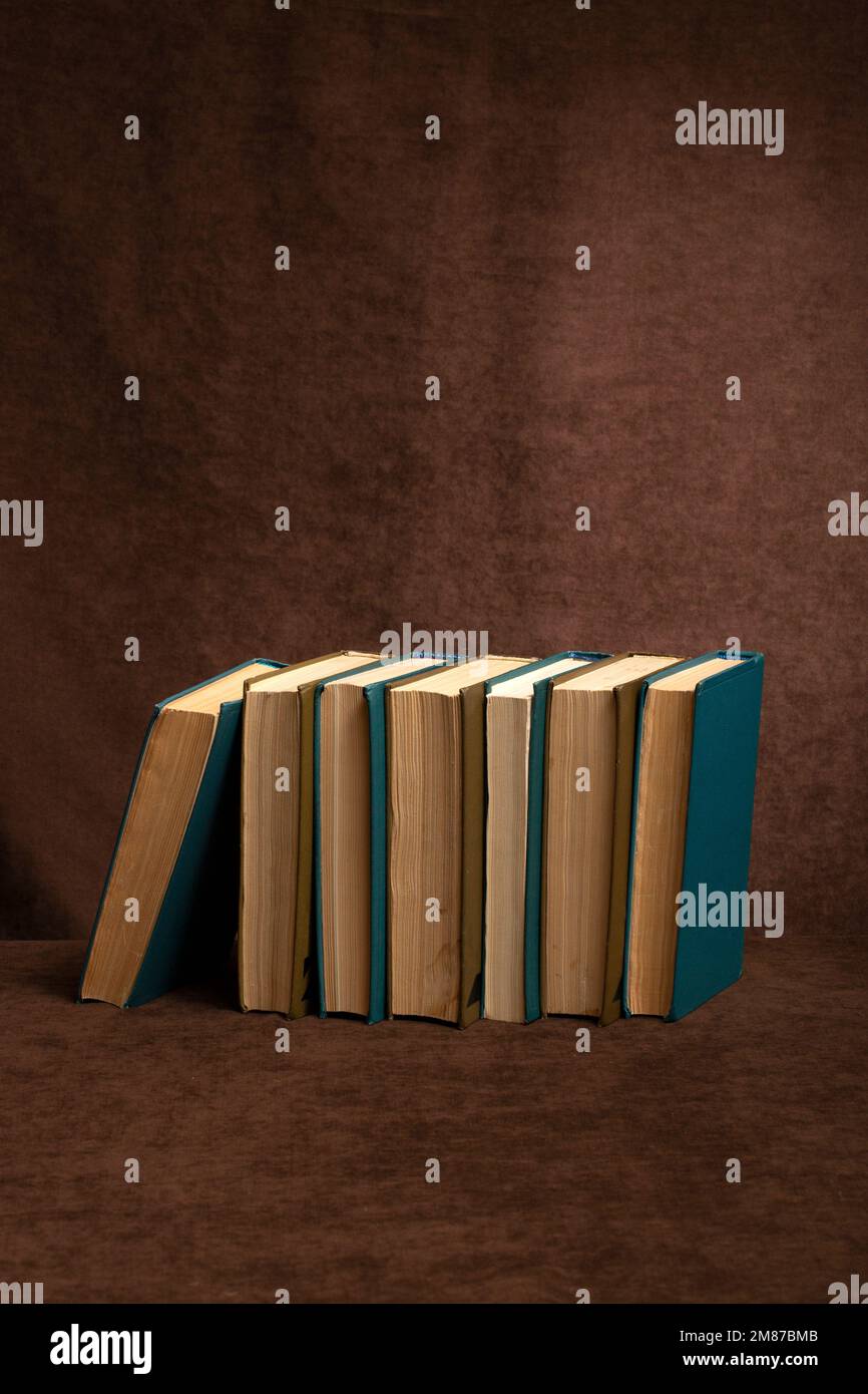 Still life with a stack of old books on the table Stock Photo - Alamy