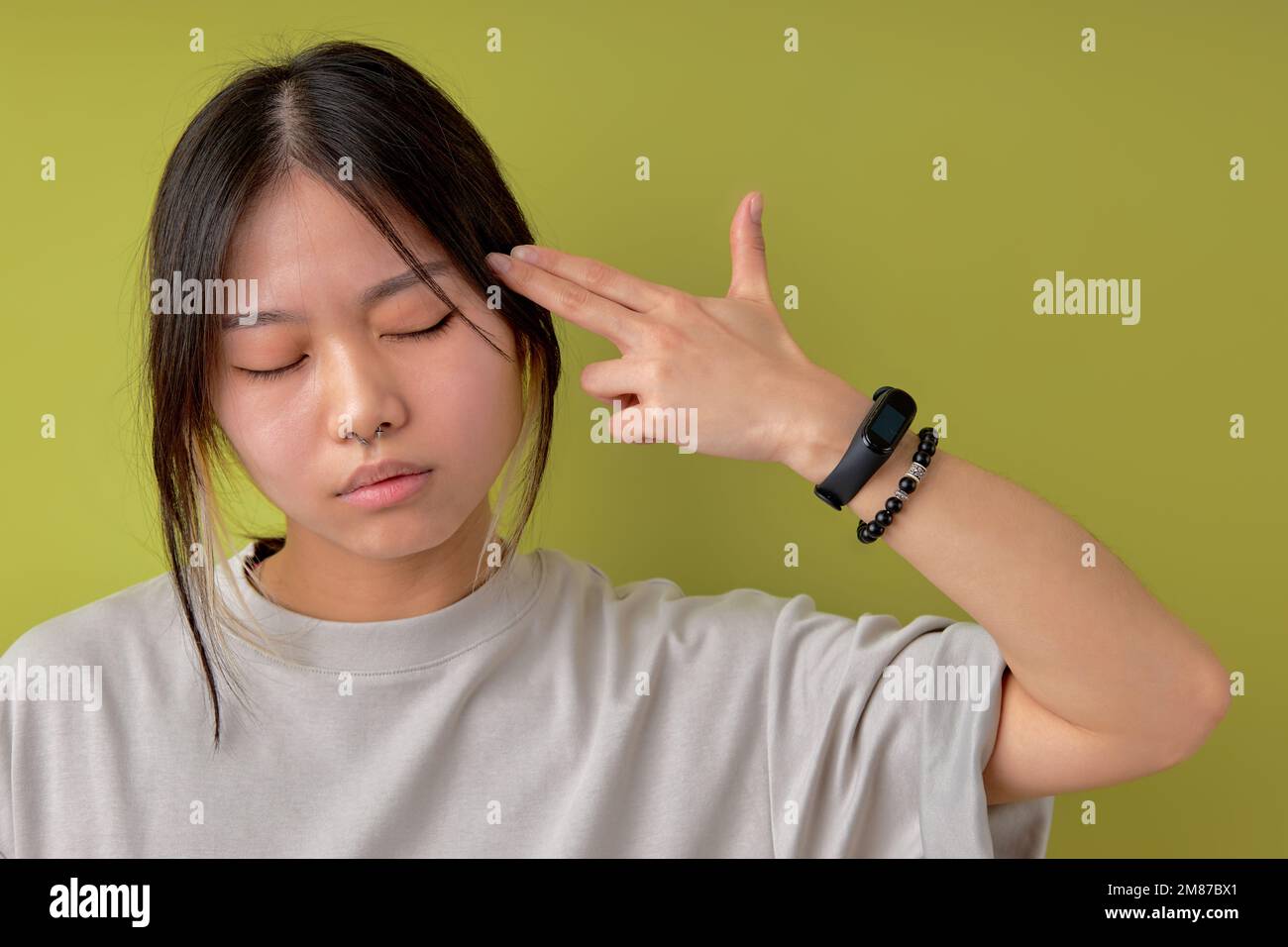 Serious attractive asian chinese woman in casual clothes holding ...