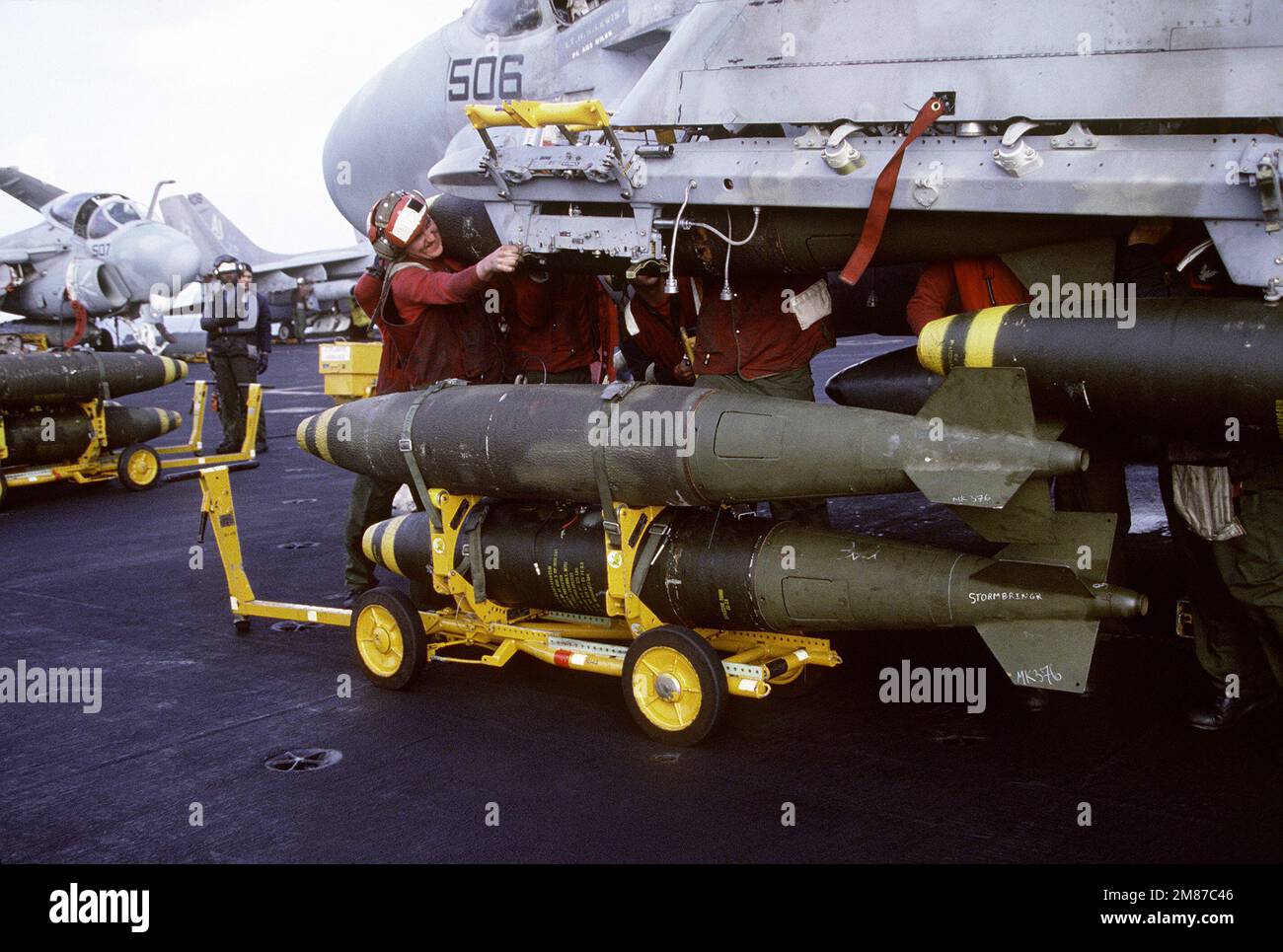 Aviation ordnancemen load Mark 82 500-pound bombs onto an A-6E Intruder ...