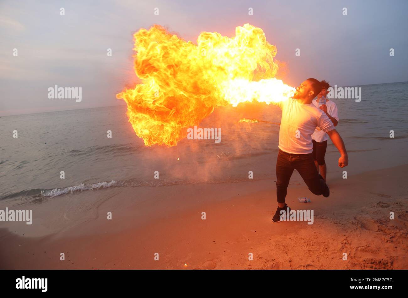 Jumping fire beach hi-res stock photography and images - Alamy