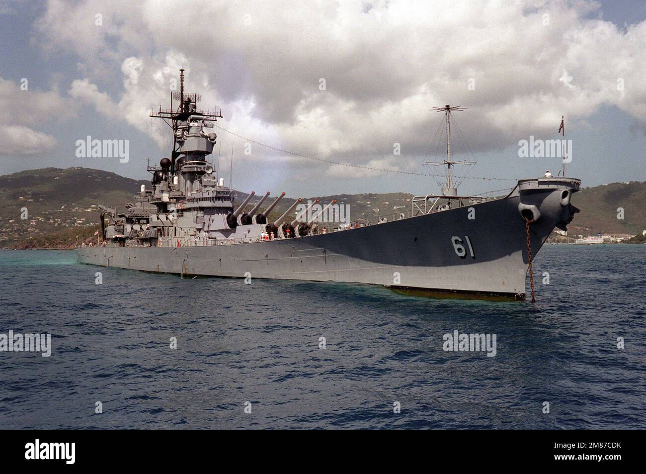 A starboard bow view of the battleship USS IOWA (BB-61) at anchor off the coast. Base: Saint ...