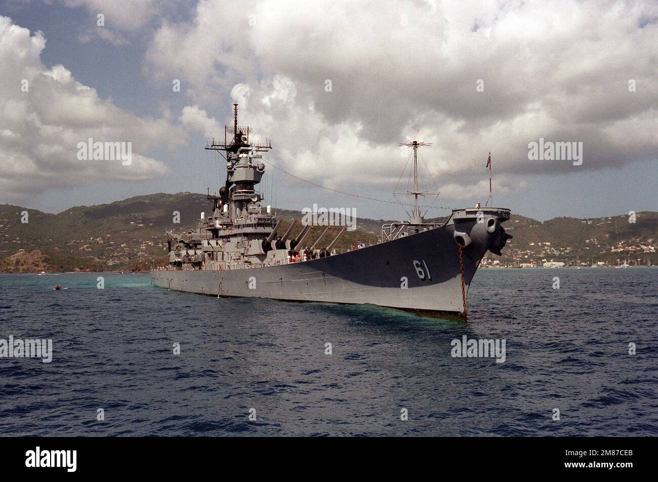 A starboard bow view of the battleship USS IOWA (BB-61) at anchor off the coast. Base: Saint ...
