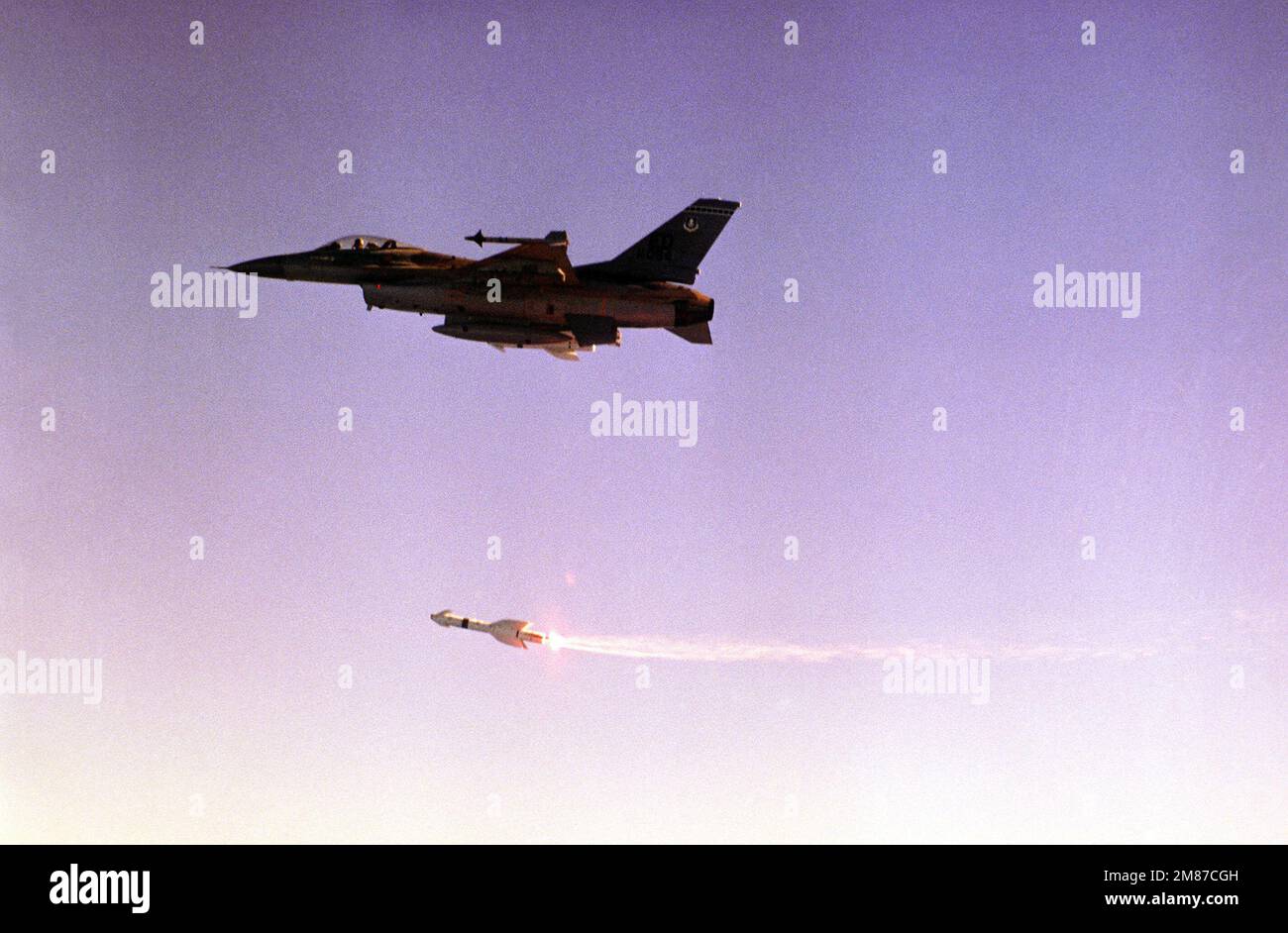 An air-to-air left side view of a Penguin missile being fired from an F ...