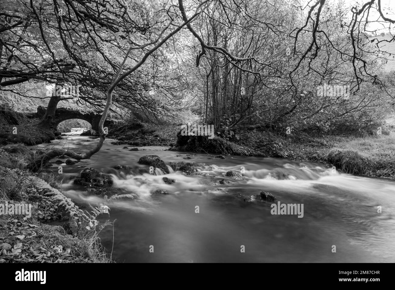 The Weir Water river flowing under Robbers Bridge in Exmoor National ...