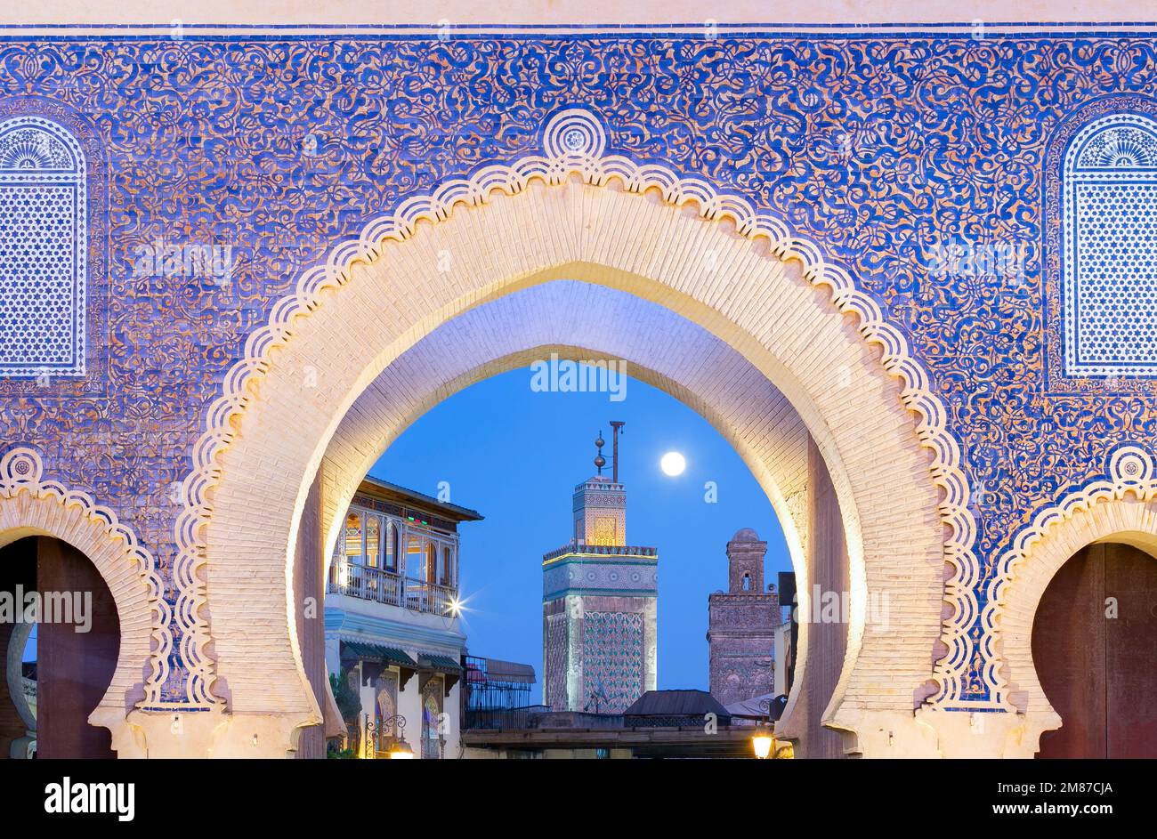 Bab Bou Jeloud gate (The Blue Gate) located at Fez, Morocco at sunset ...
