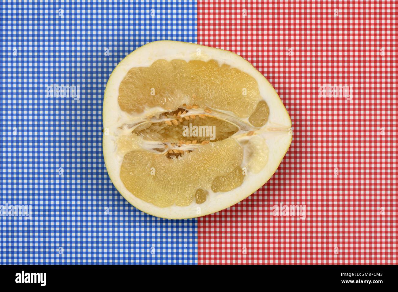 Perfectly retouched pomelo on a red cage background. High resolution ...