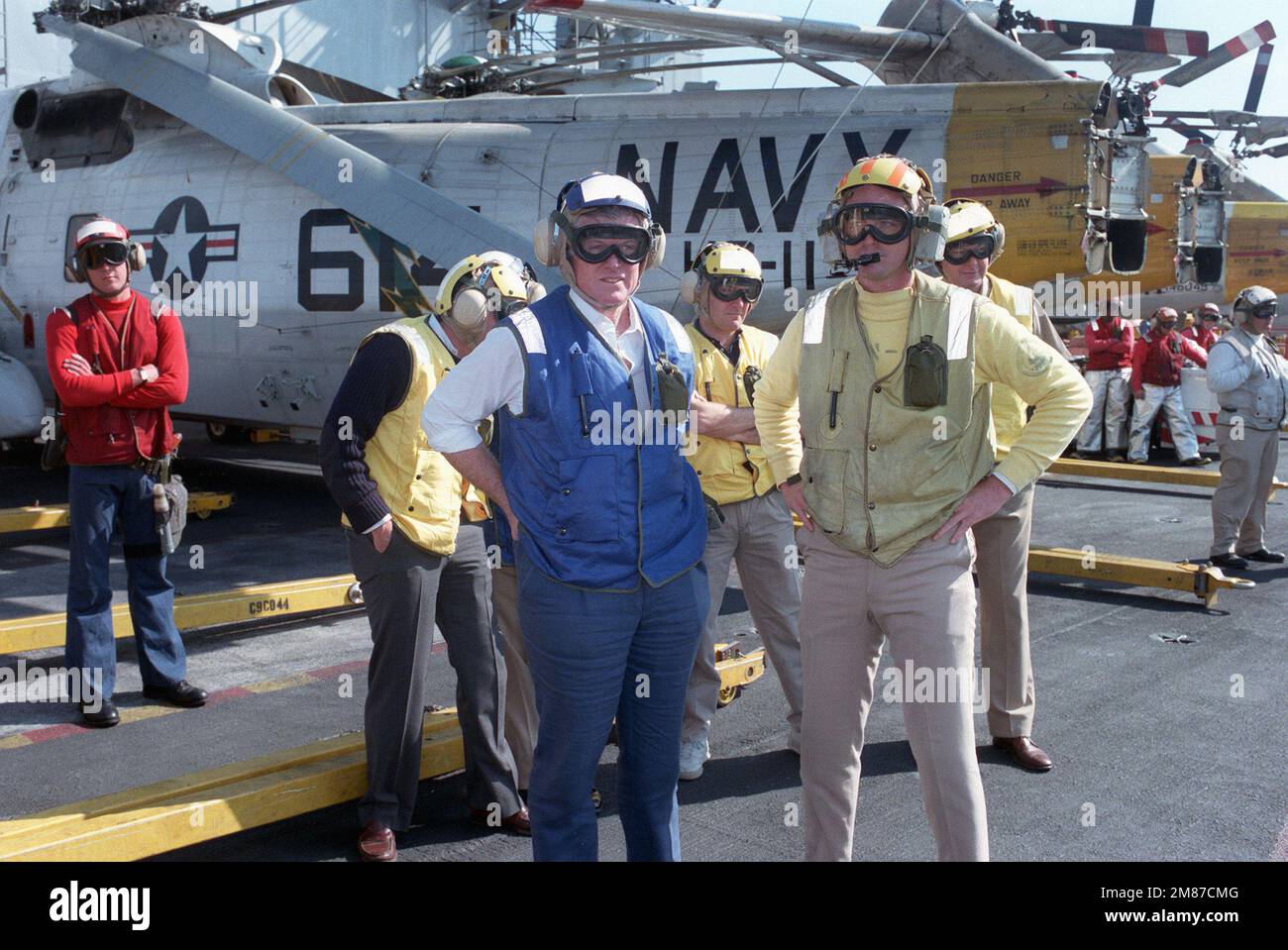 Senator Edward Kennedy, D-Massachusetts, wearing a flight deck helmet ...