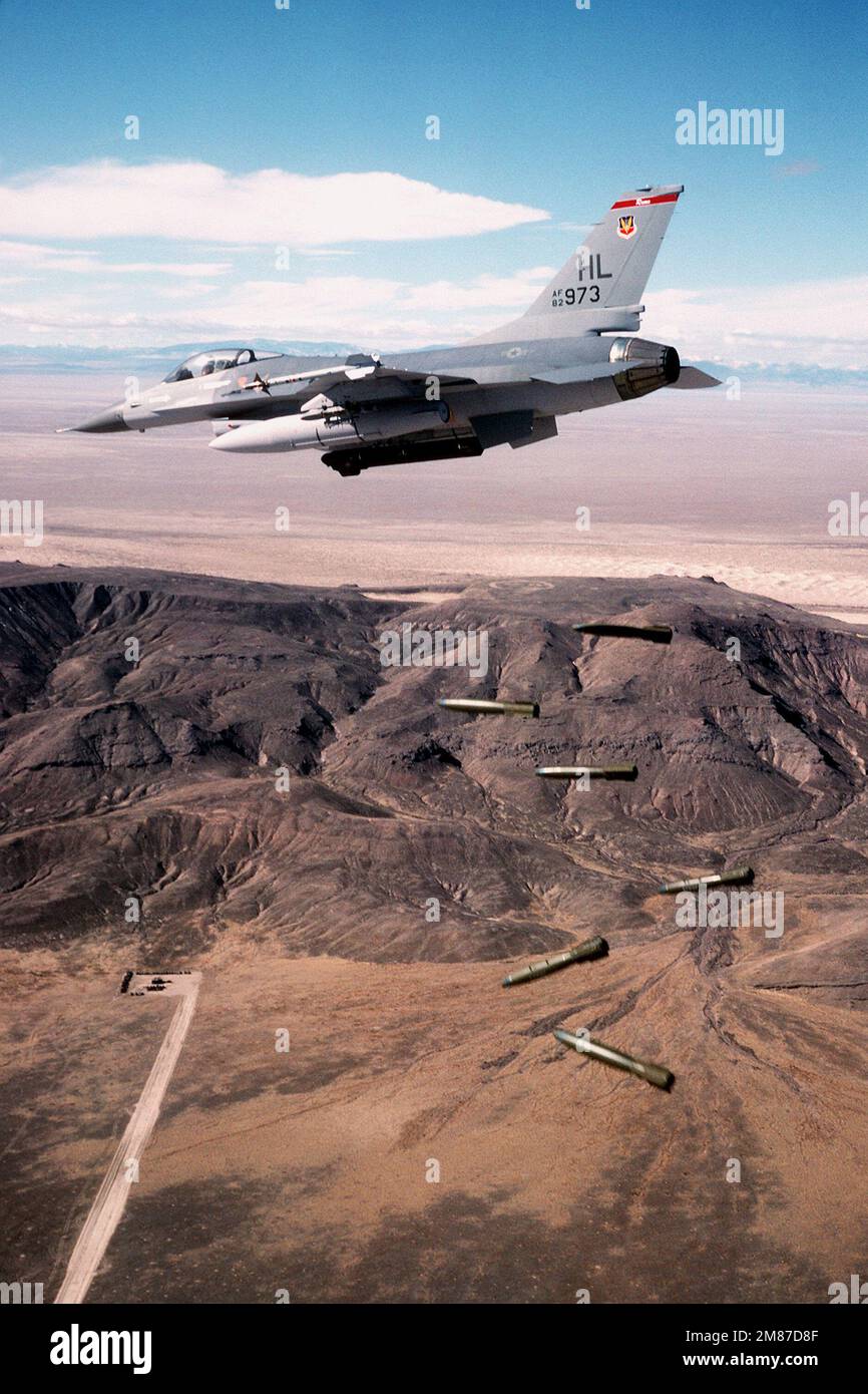 An air-to-air left side view of an F-16 Fighting Falcon aircraft of the ...