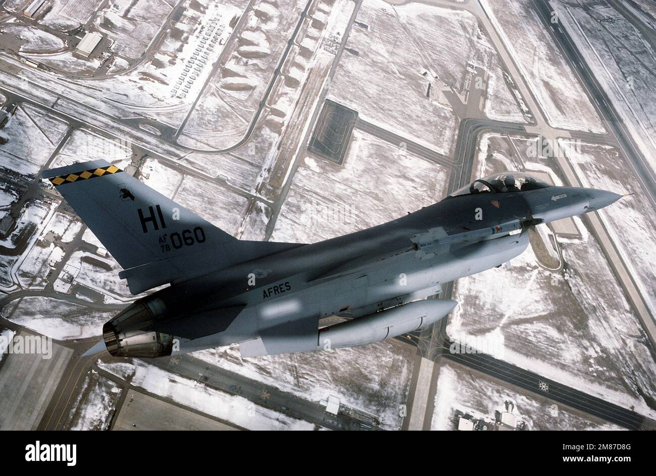 An air-to-air right rear view of an F-16 Fighting Falcon aircraft of ...