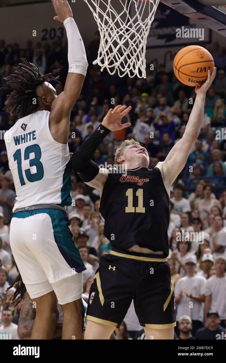 Charleston guard Ryan Larson (11) drives in for a shot against UNC ...