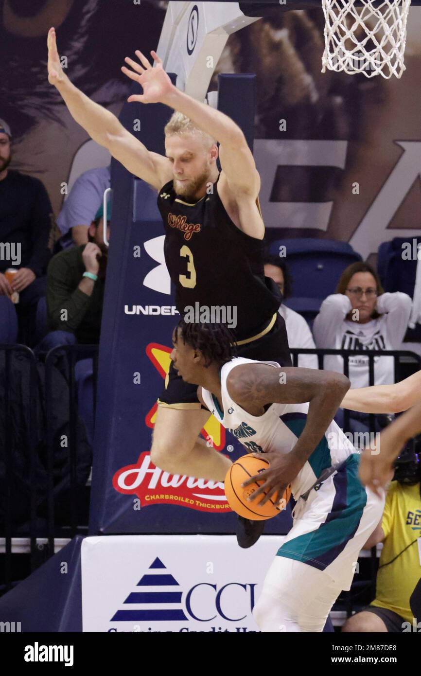 Charleston guard Dalton Bolon (3) goes high to defend UNC Wilmington ...