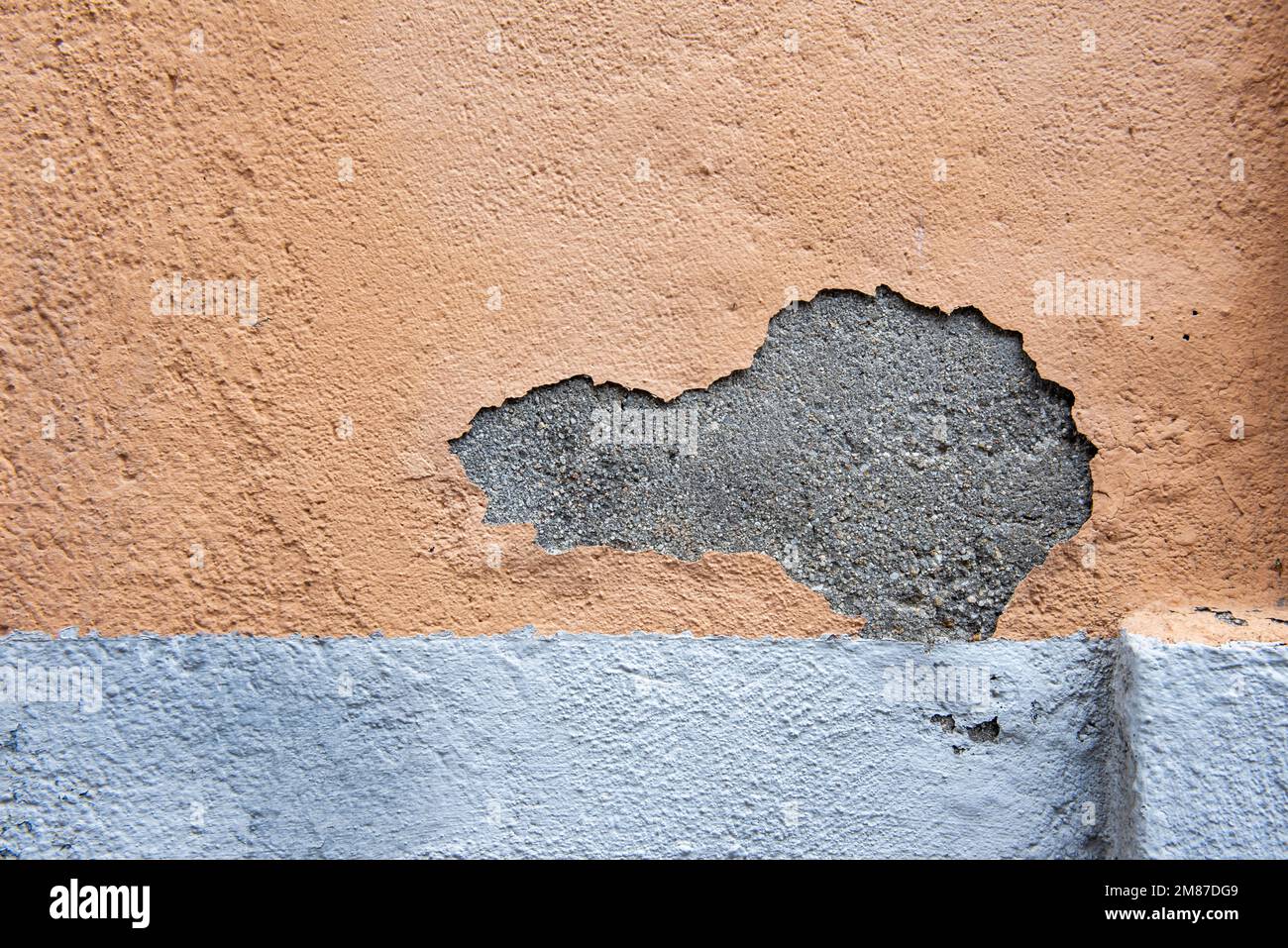 Cement wall painted in two tones with a large chip. Vector cement ...