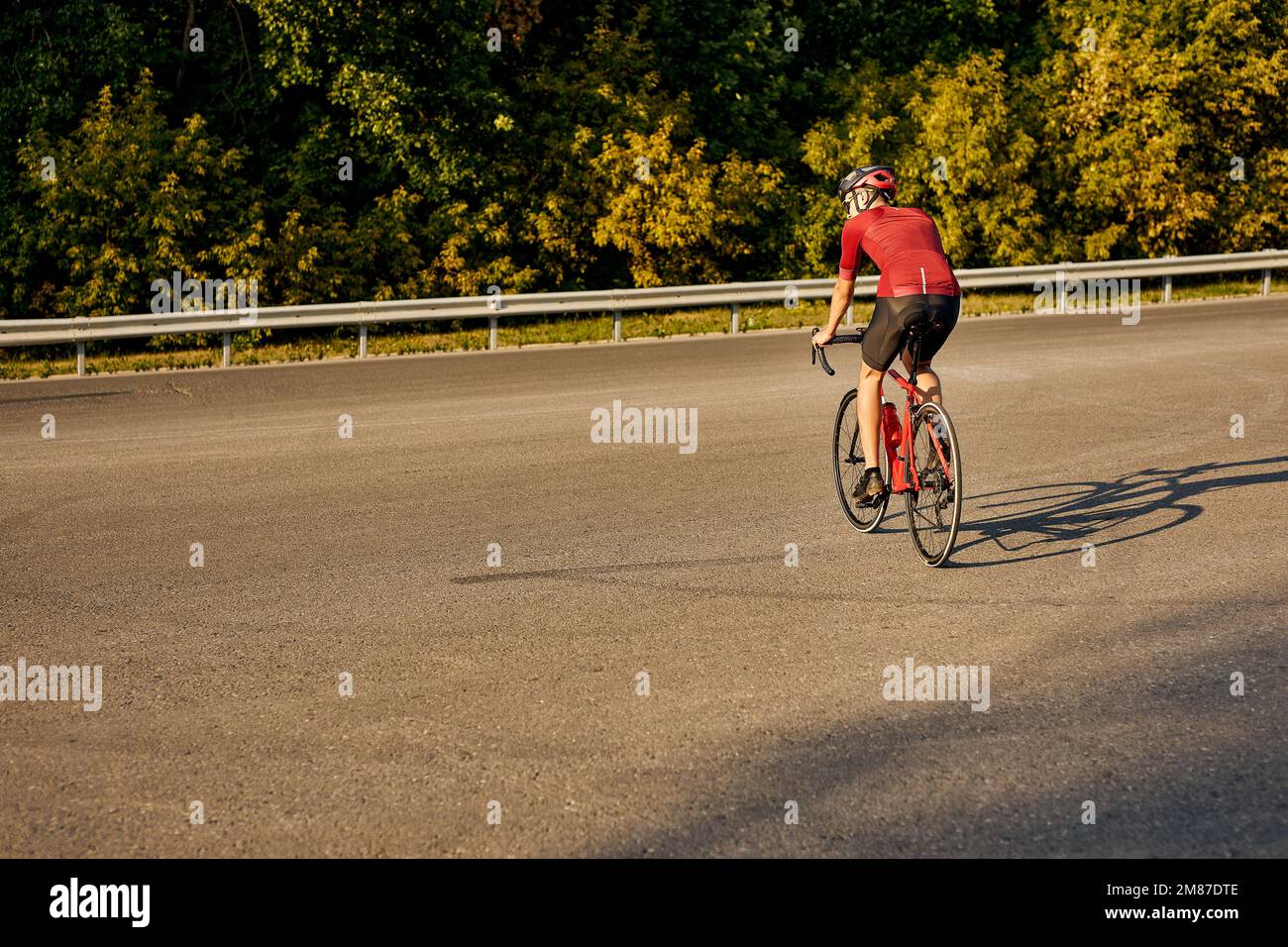 Rear view on young caucasian man wearing sport uniform and glasses ...