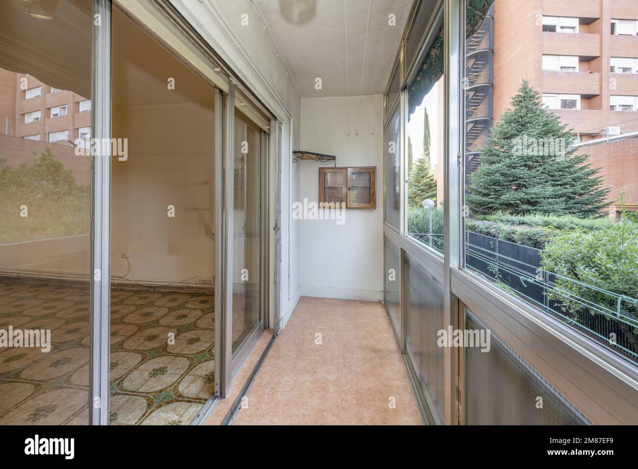 Glazed balcony type terrace at the exit of a living room of a house ...