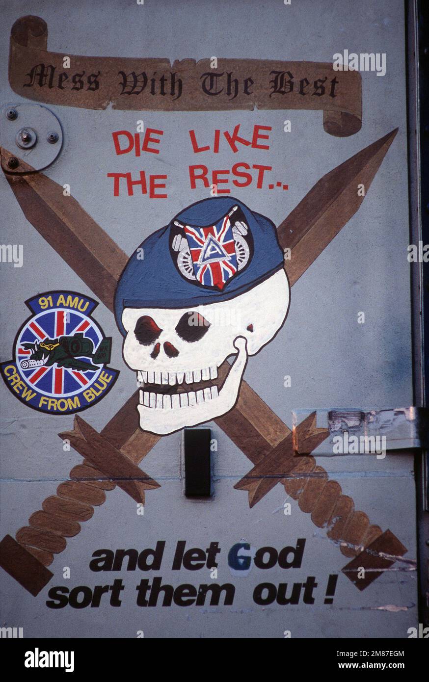 Artwork and a motto decorate the inside of the access hatch on a 91st ...