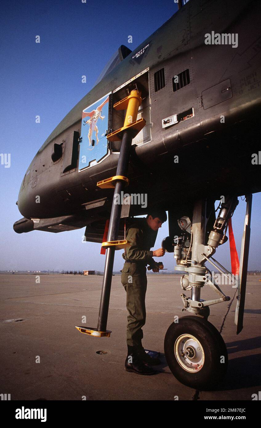 A member of the 91st Aircraft Maintenance Unit (91st AMU) inspects the ...