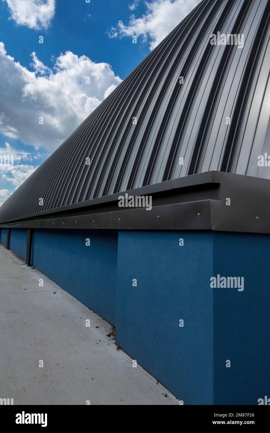 architectural detail of a building with a blue and black vaulted roof ...
