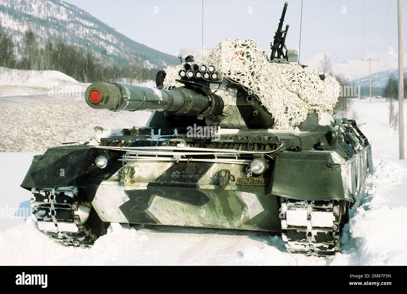 A Norwegian Leopard 1 main battle tank moves through the snow during exercise Cold Winter '87 ...