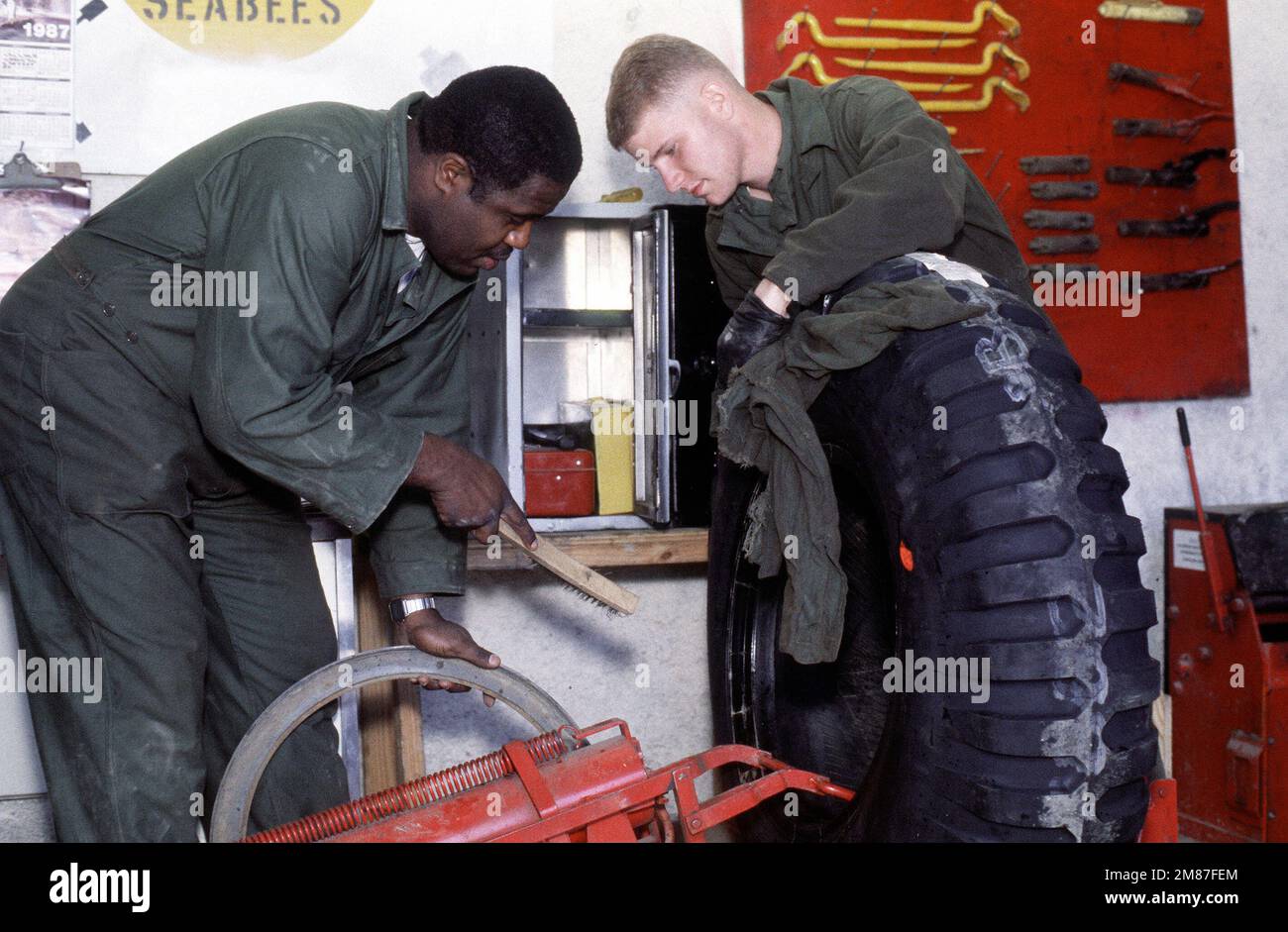 Hull Technician 1ST Class Joel Gulley, left, gives Equipment Operator ...
