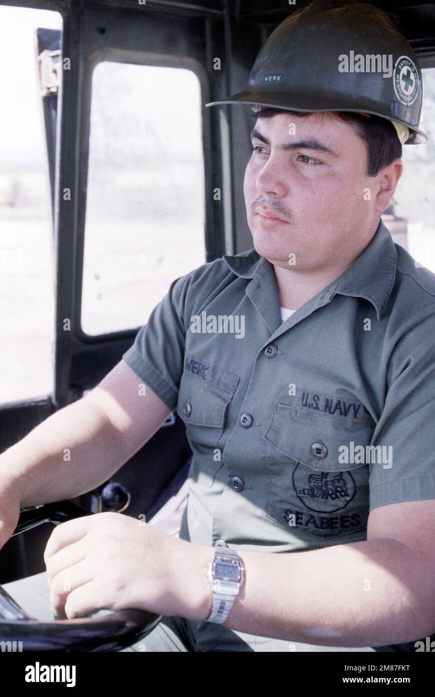 SEAMAN Howard Werk of Naval Mobile Construction Battalion 4 operates a ...
