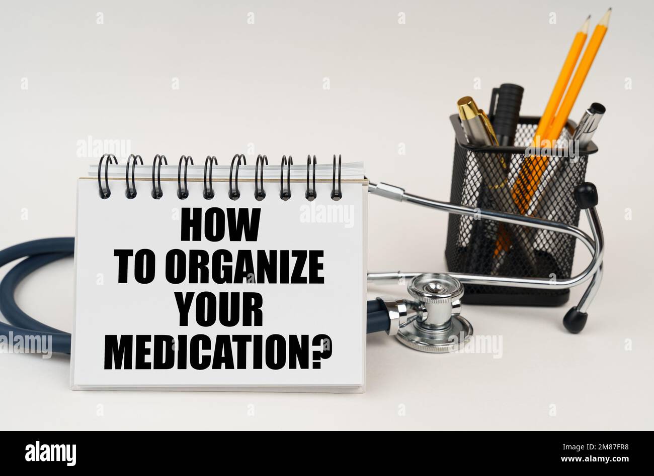 Medical concept. On the table are office supplies, a stethoscope and a ...