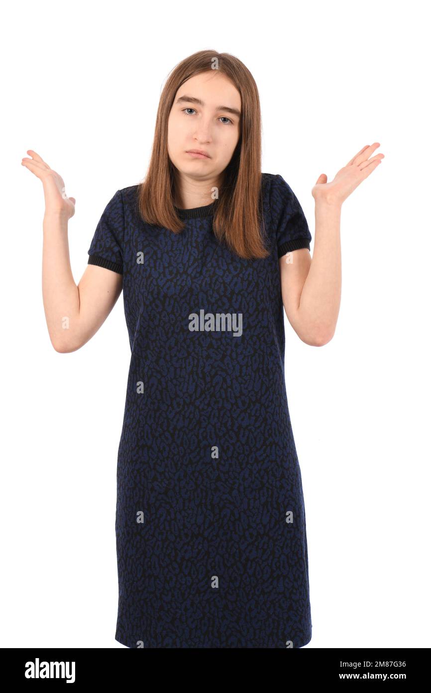 Young beautiful girl in a dark blue dress on a white background ...