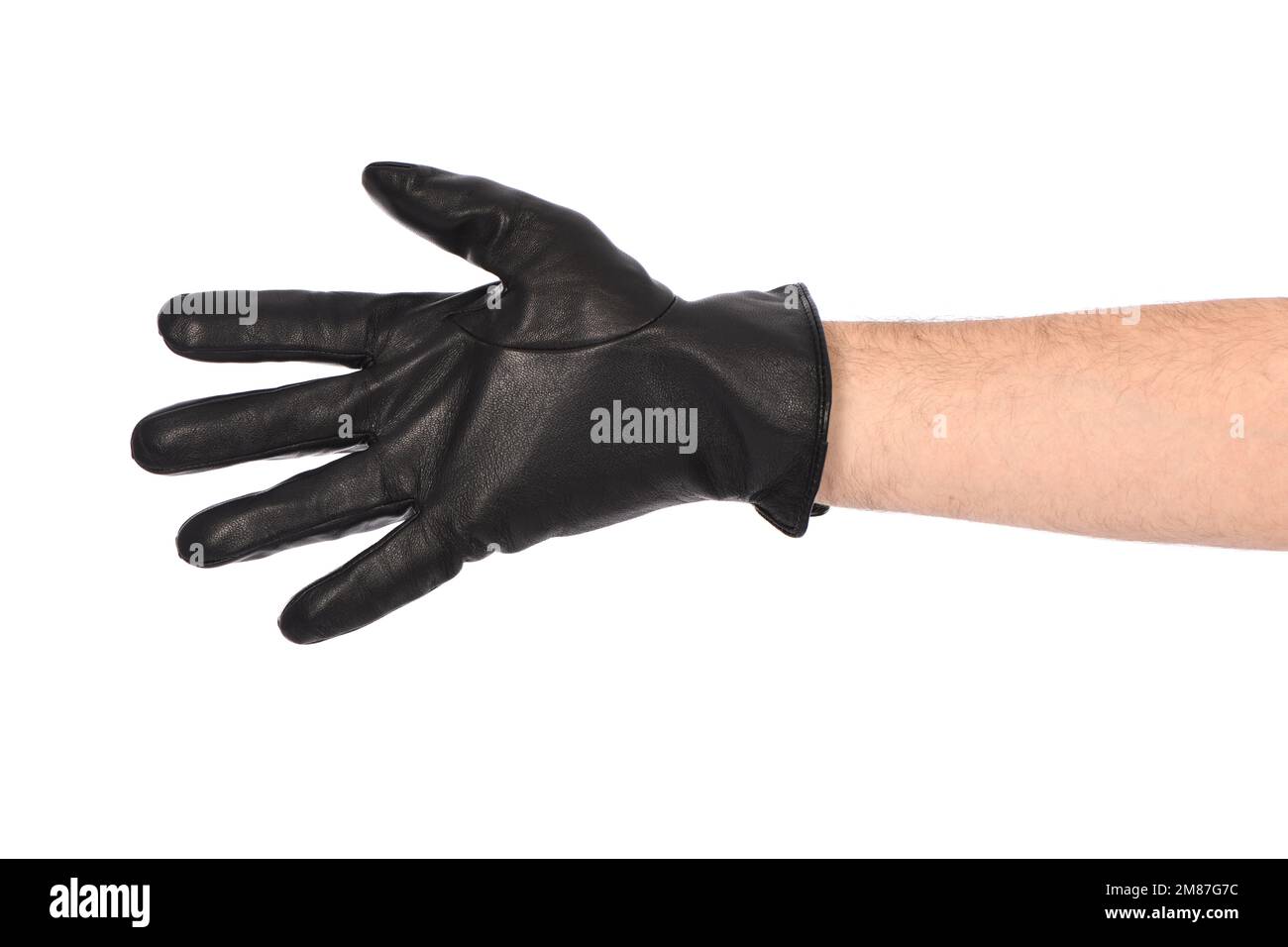 Man wearing black leather glove on white background, closeup. Side view ...
