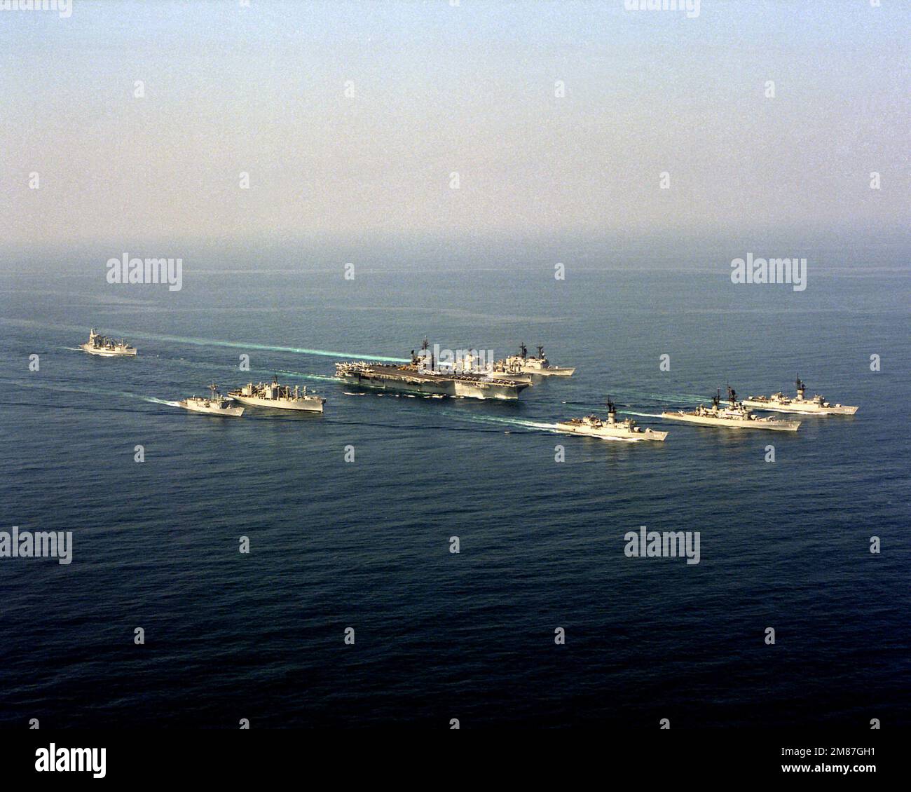 An aerial starboard bow view of the aircraft carrier USS KITTY HAWK (CV ...
