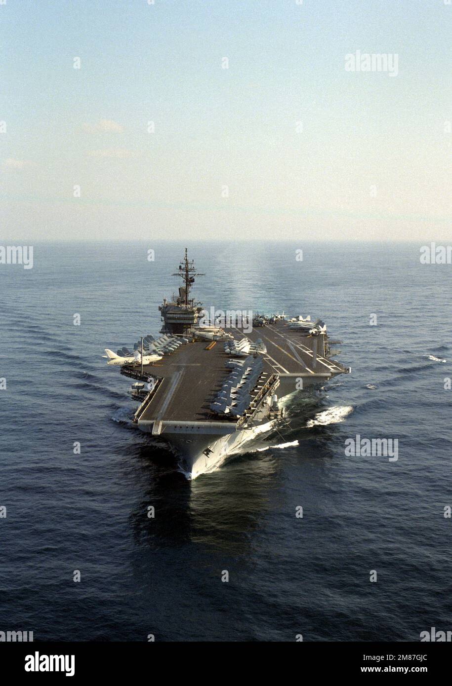 An aerial port bow view of the aircraft carrier USS KITTY HAWK (CV-63 ...
