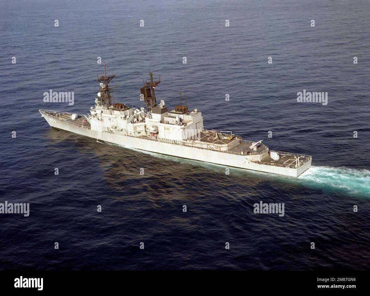 An aerial port quarter view of the guided missile destroyer USS ...