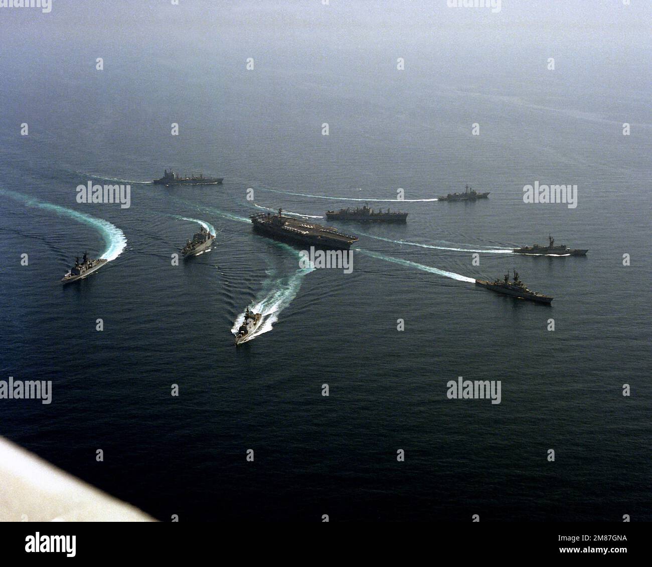 An aerial view of various U.S. ships of the KITTY HAWK battle group ...