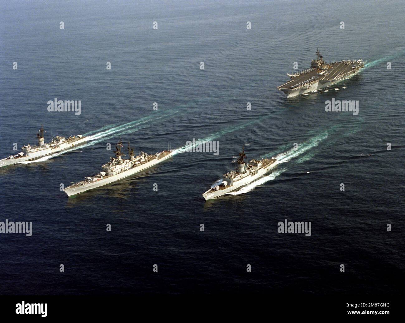 An aerial port bow view of various U.S. Navy ships of the aircraft ...