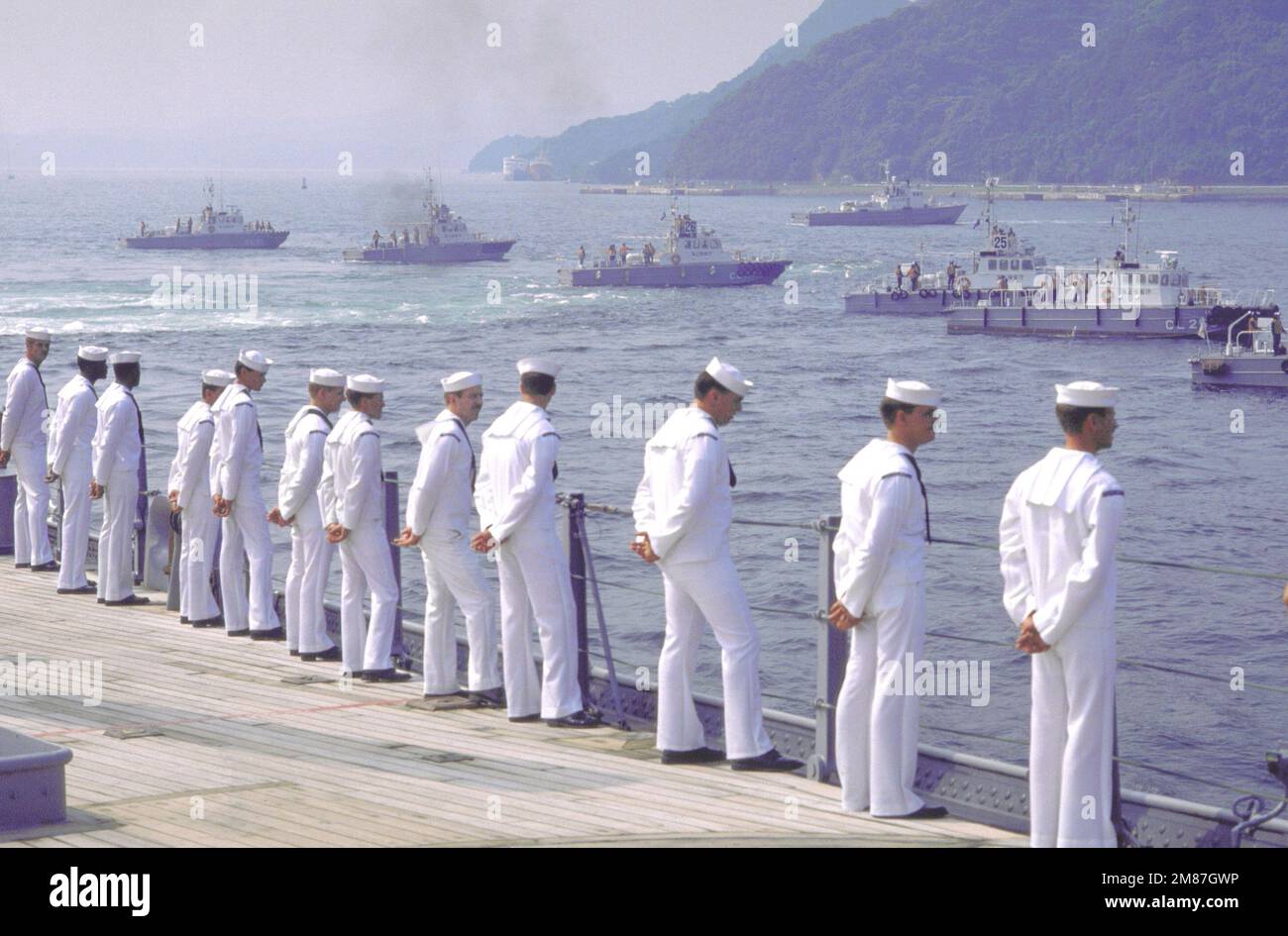 Sailors man the rail as the battleship USS NEW JERSEY (BB-62) as ...