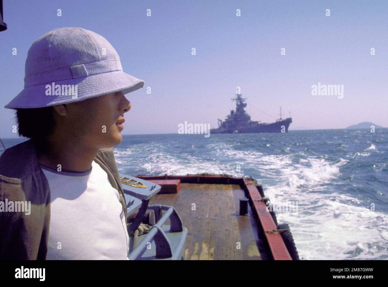 A seaman goes ashore aboard a civilian liberty boat during a port visit ...