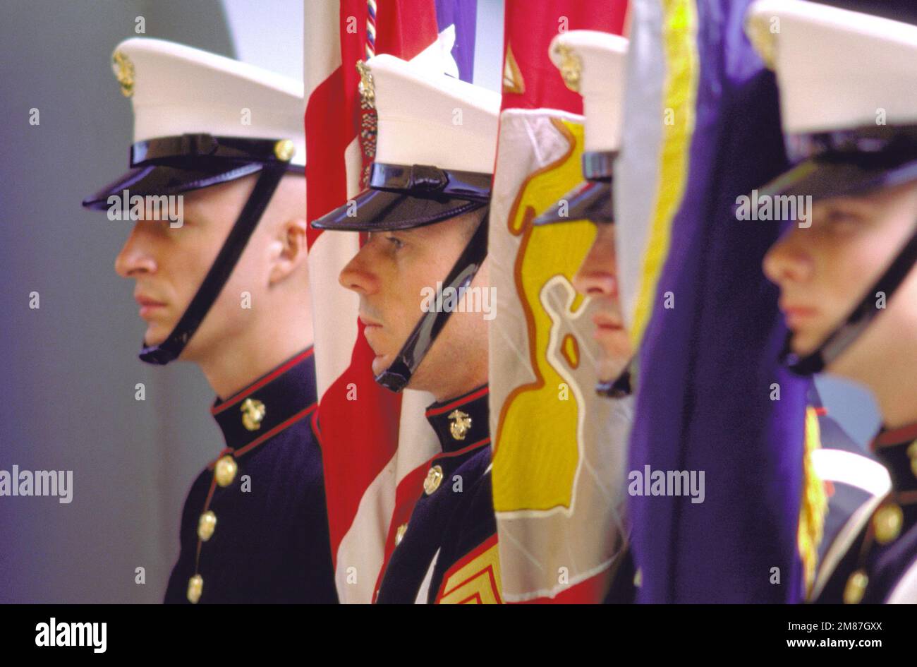 A Marine color guard participates in a ceremony aboard the battleship ...