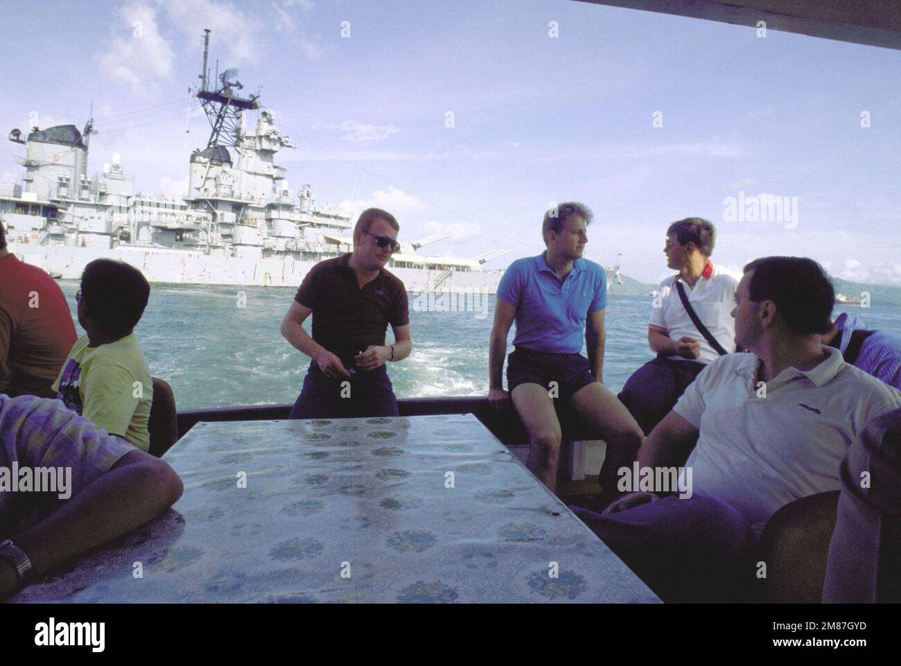 Sailors go ashore aboard a civilian liberty boat during a port visit by ...