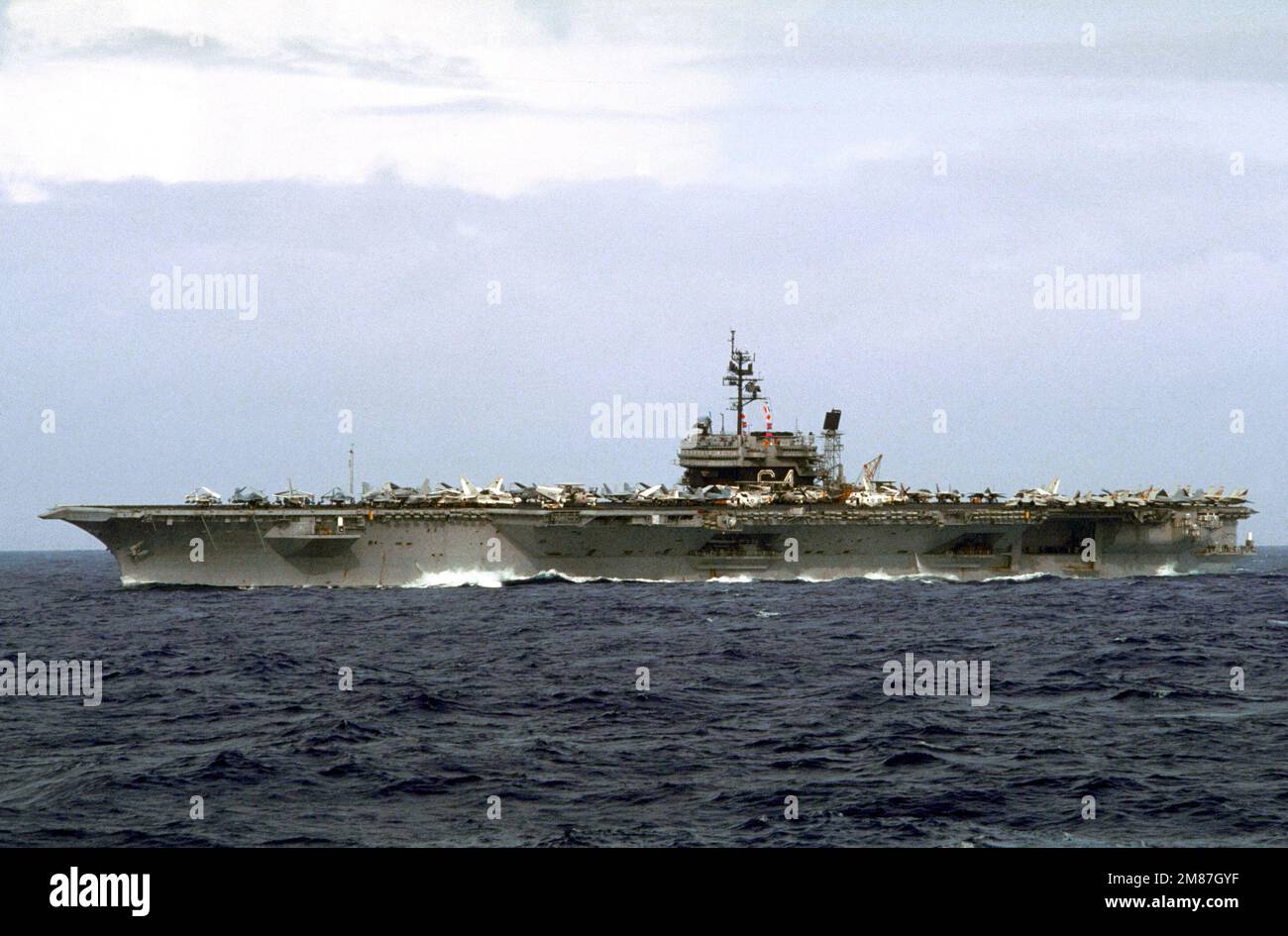 A port beam view of the aircraft carrier USS CONSTELLATION (CV-64 ...