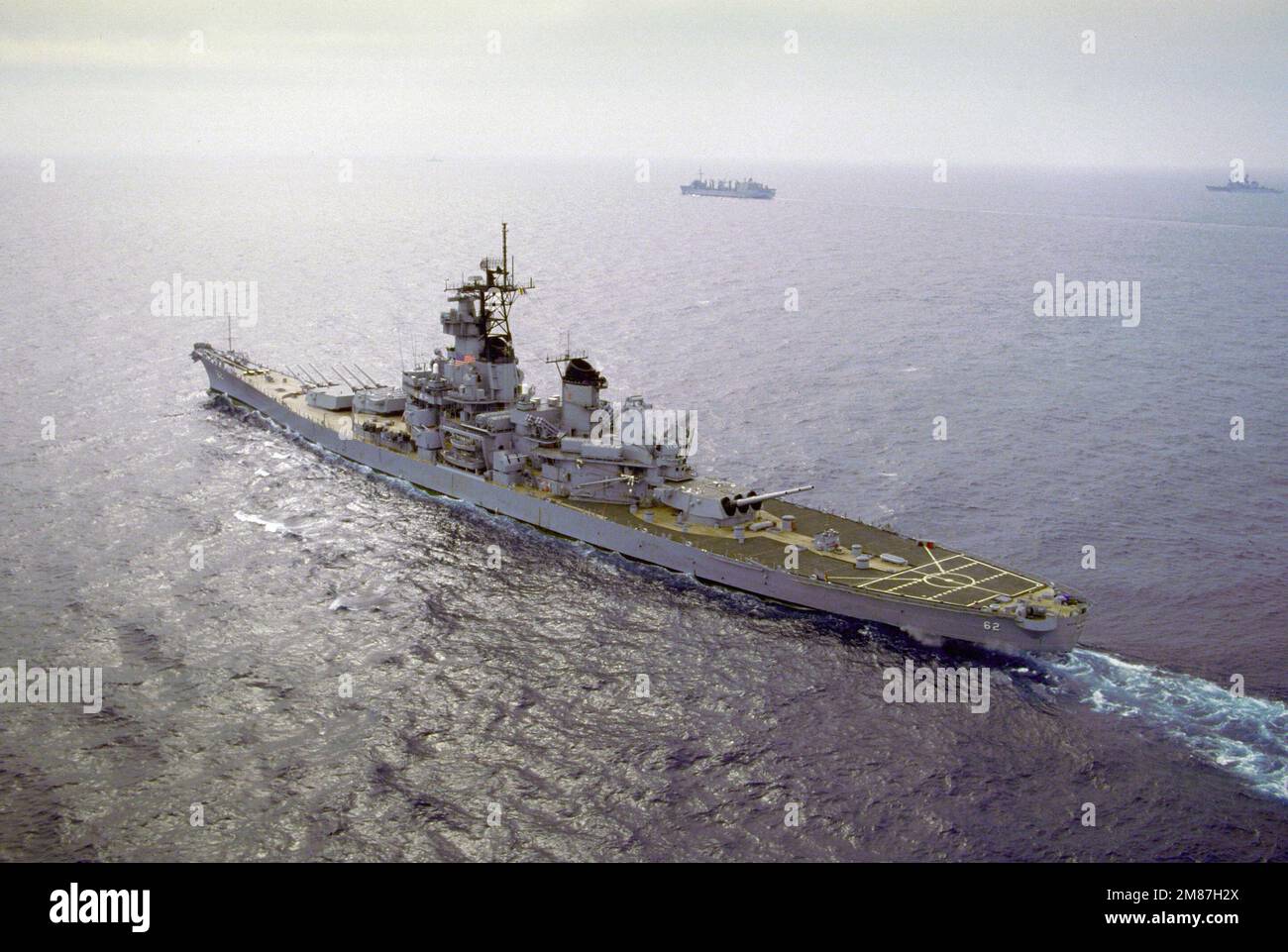 An elevated port quarter view of the battleship USS NEW JERSEY (BB-62 ...