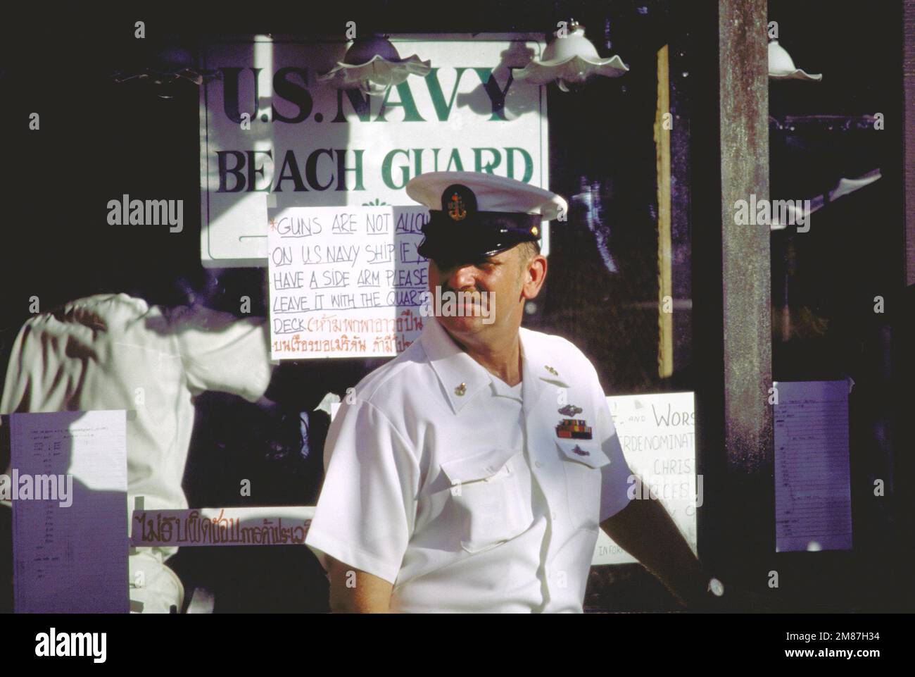 A chief petty officer from the battleship USS NEW JERSEY (BB-62) stands ...