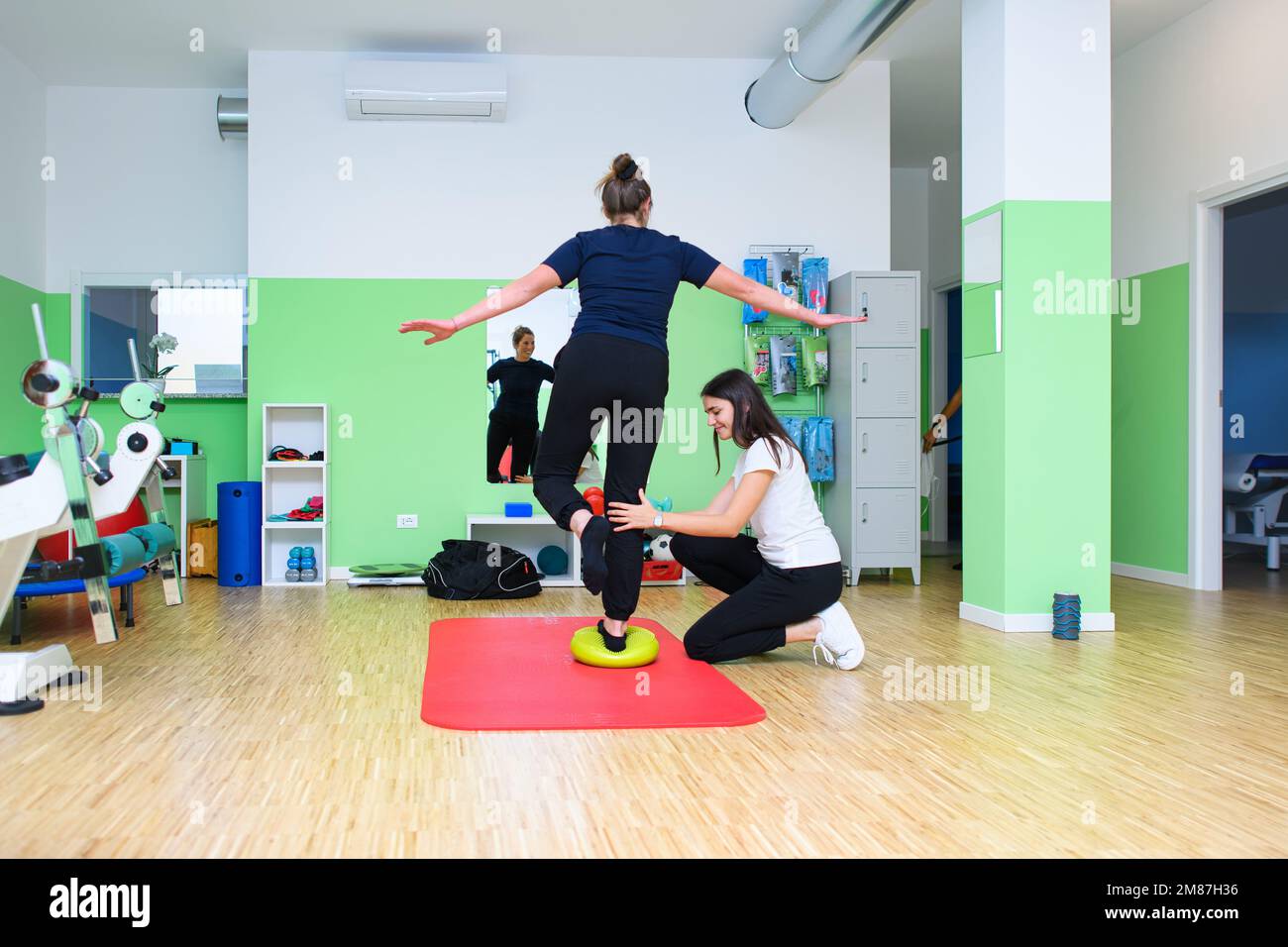 A Physiotherapist Has A Patient Perform Exercises For Ankle ...