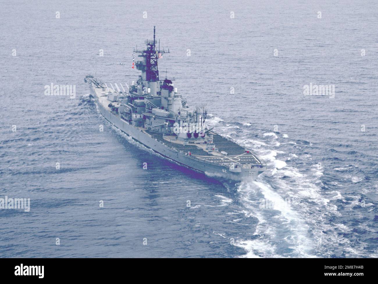 An elevated port quarter view of the battleship USS NEW JERSEY (BB-62 ...