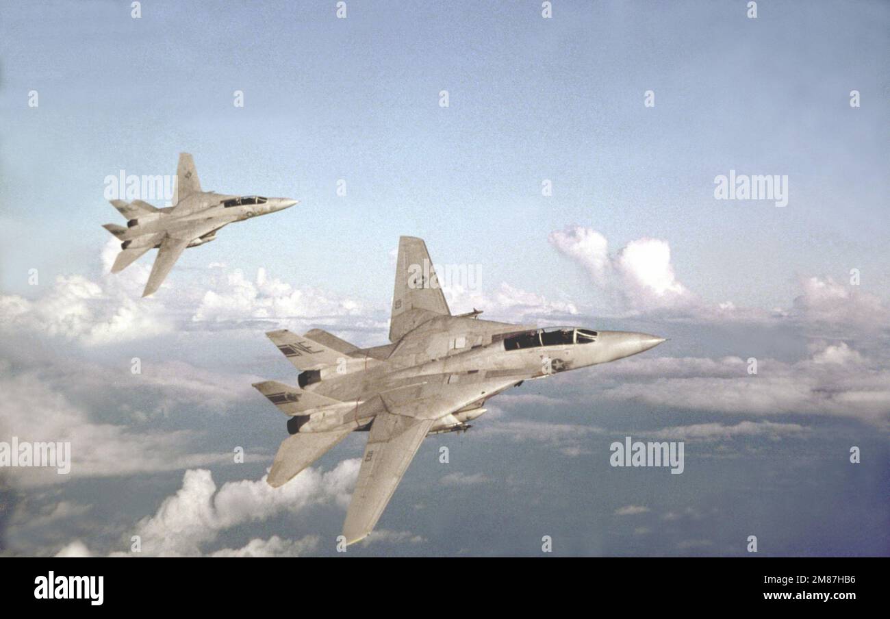 An air-to-air right side view of two fighter Squadron 1 (VF-1) F-14A ...