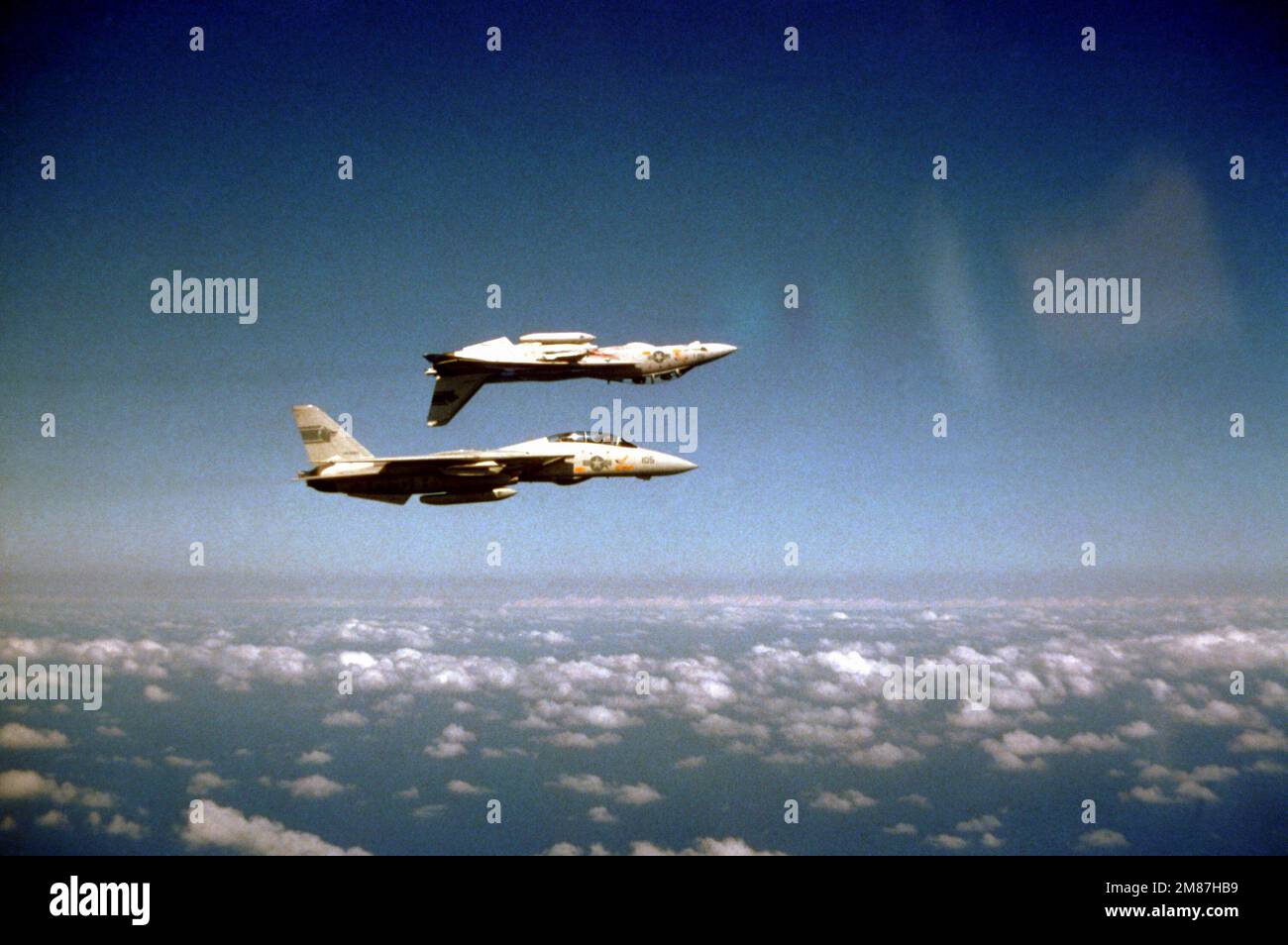 An air-to-air right side view of two Fighter Squadron 1 (VF-) F-14A ...