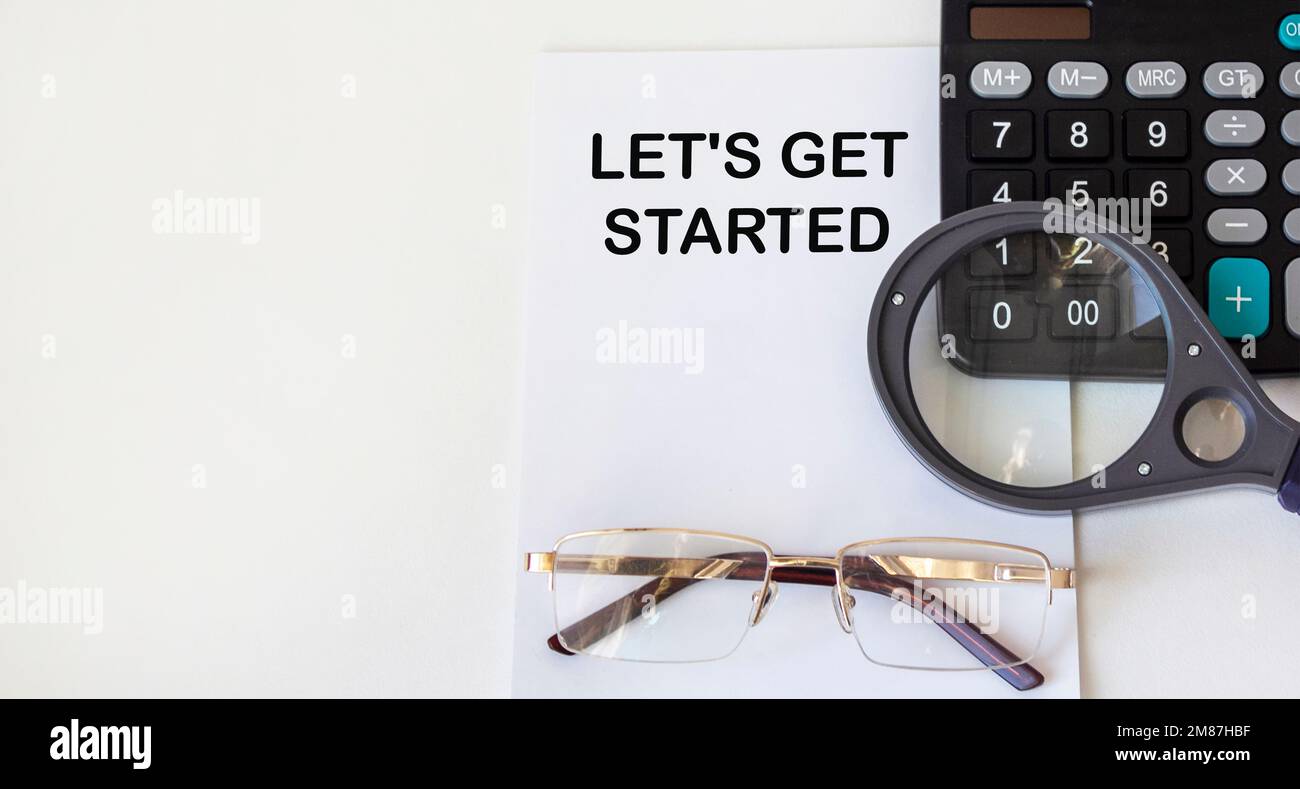 LET'S START text concept on notepad with office tools on white ...