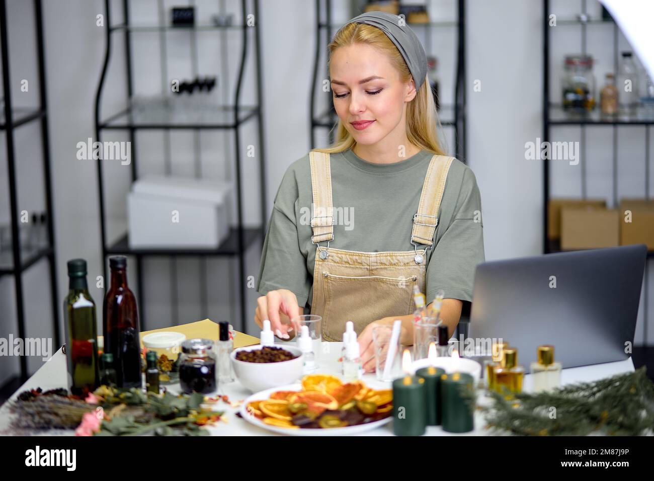 caucasian perfumer take bottle for mixing fragrance and essential oil ...
