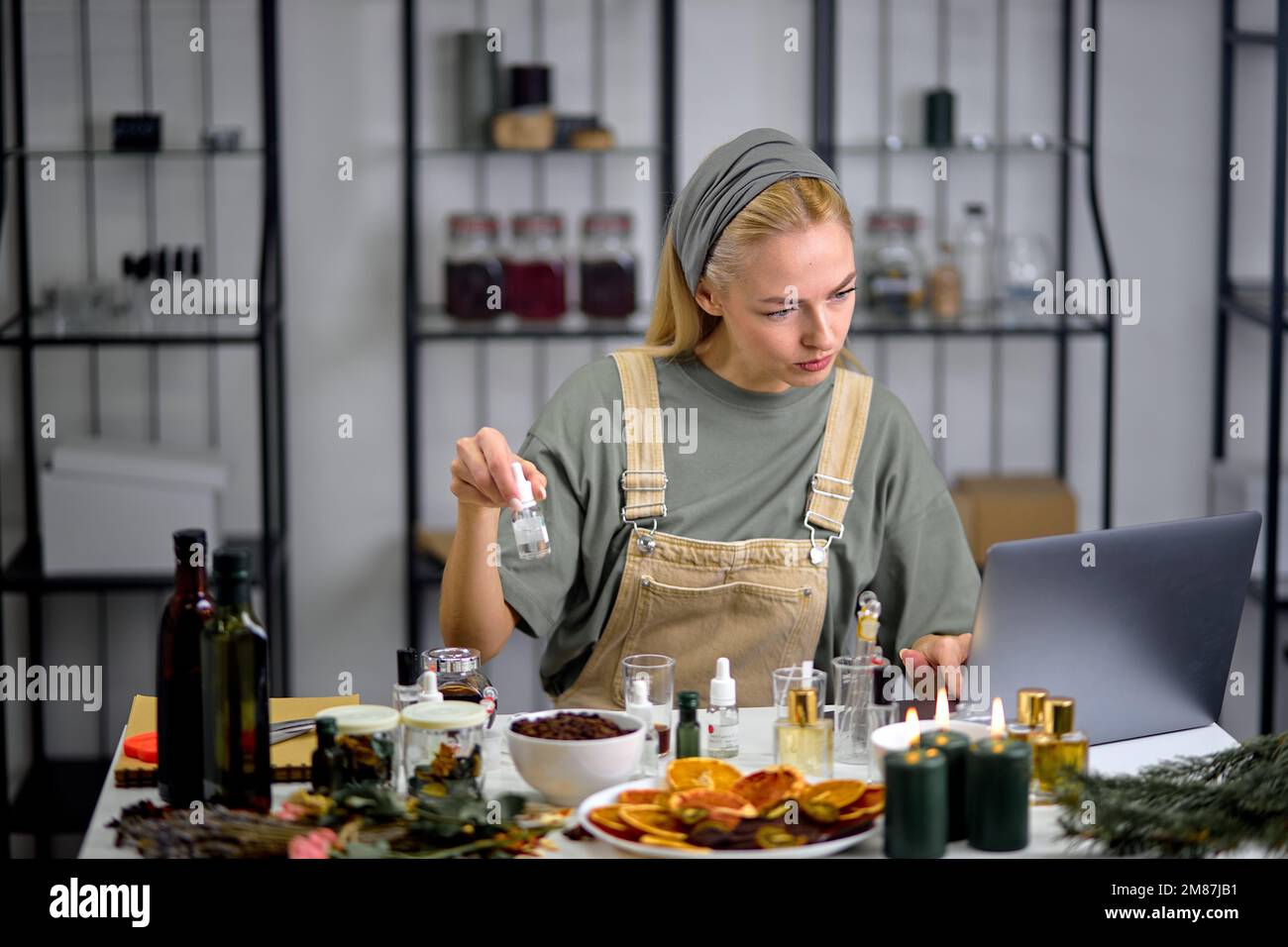 fragrance a on table with many bottles of essential oil is testing ...