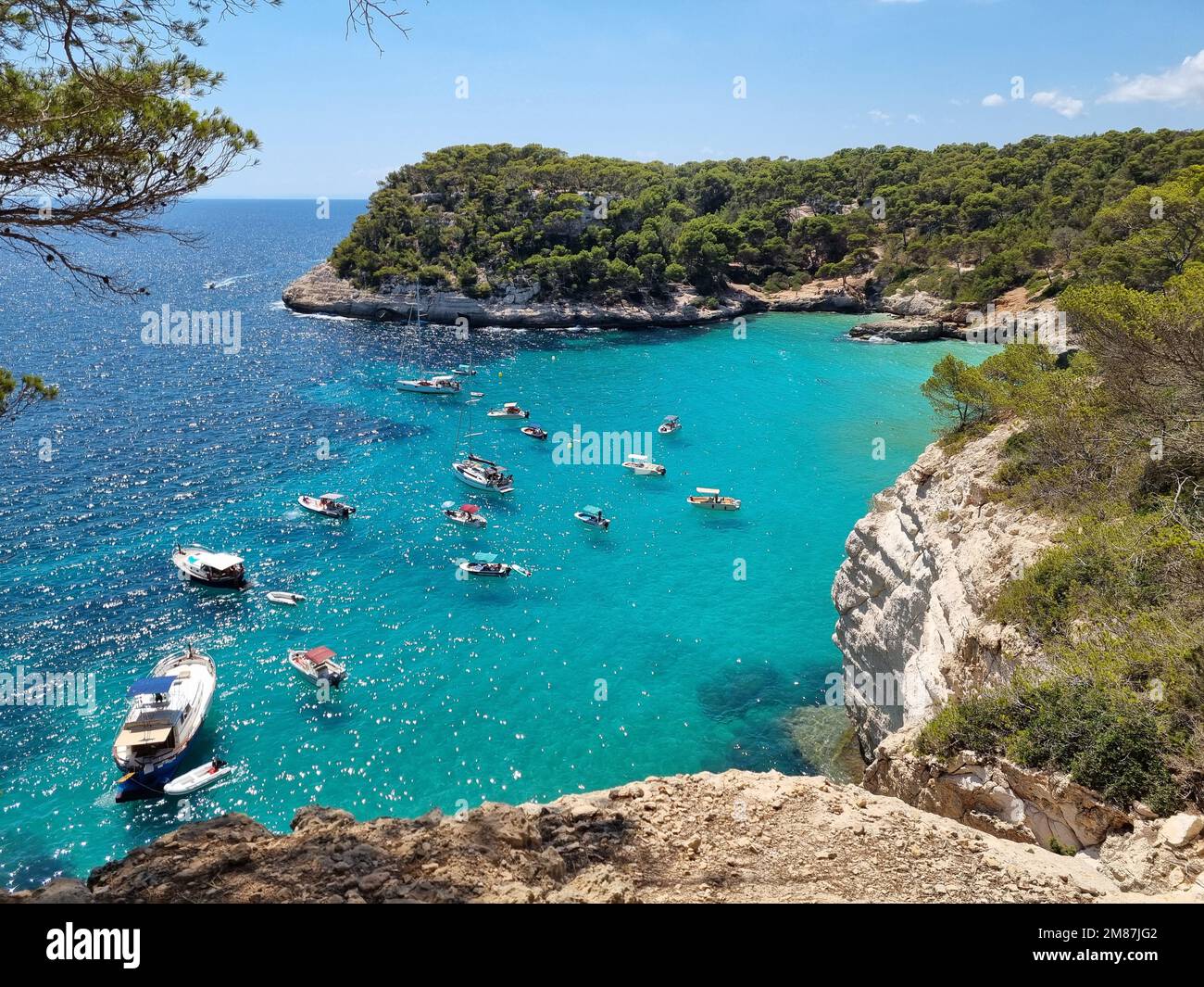 View of turquoise sea in beautiful bay Cala Mitjaneta in Menorca Stock ...
