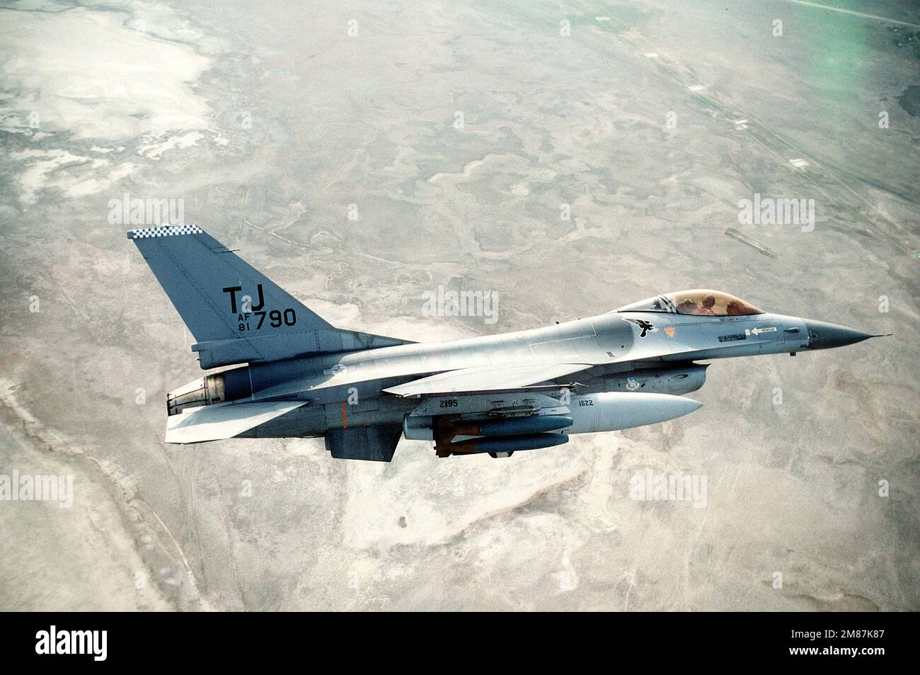 An air-to-air right side view of a 401st Tactical Fighter Wing F-16 ...
