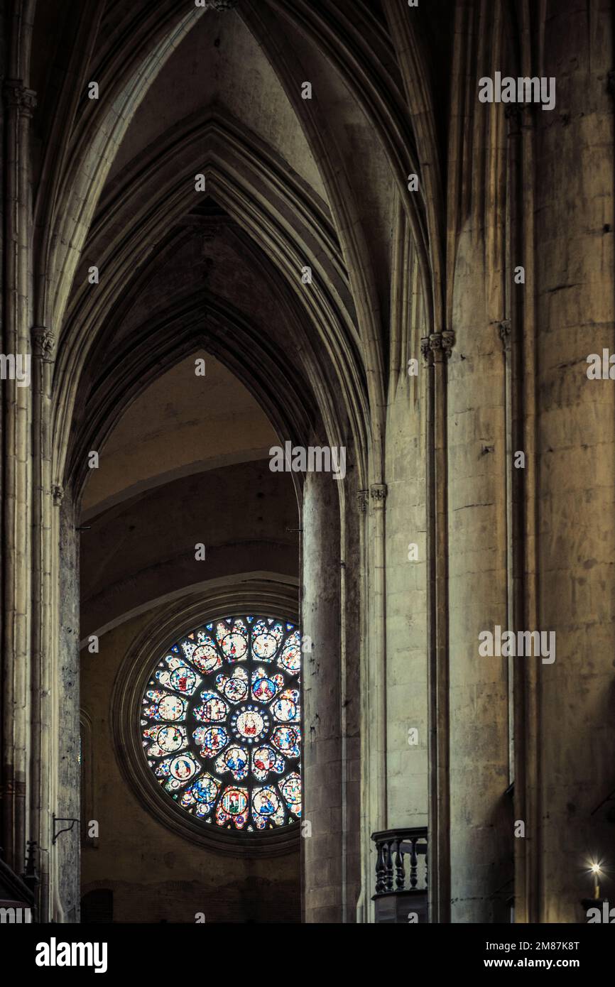 Rose window and aisle of the medieval gothic cathedral of Saint Etienne ...